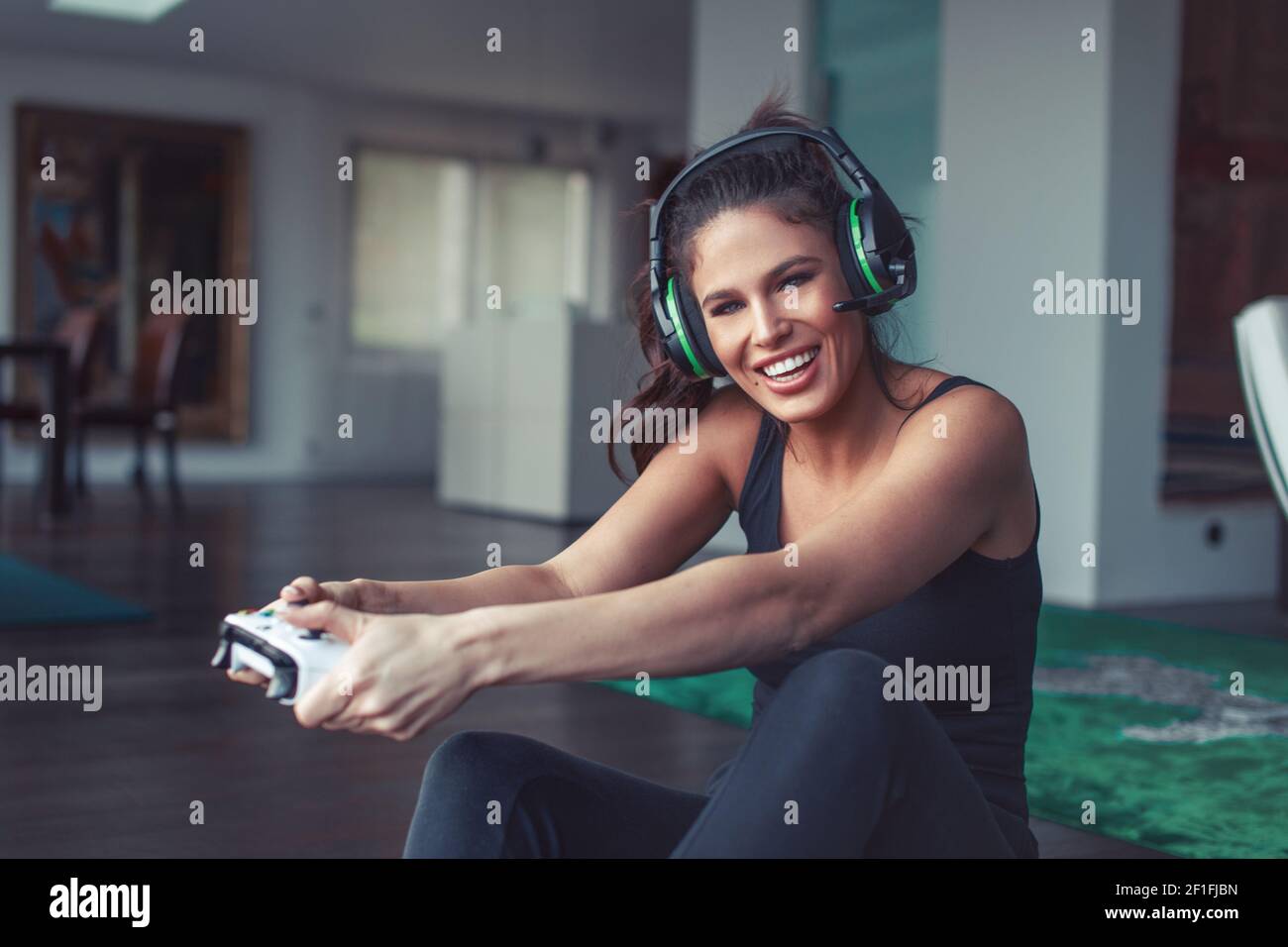 Happy young Caucasian gamer woman toothy smile, holding console Stock ...