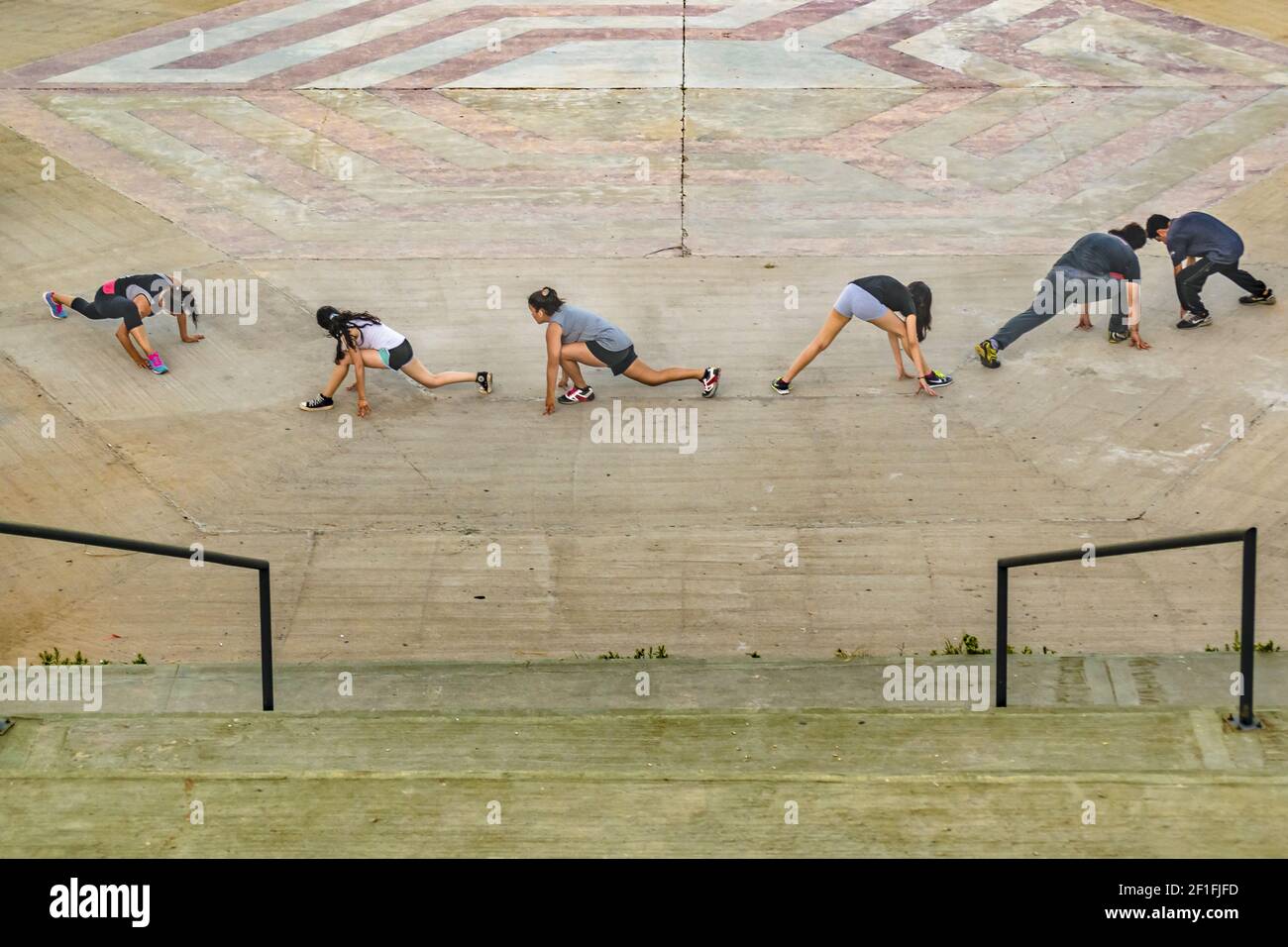 People Doing Exercise at Urban Square Stock Photo - Alamy