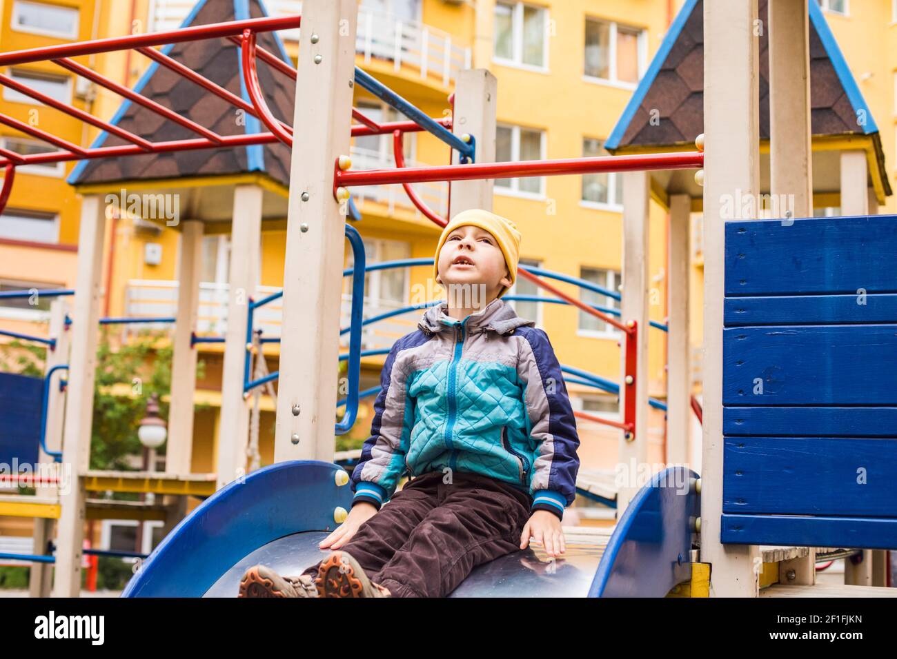 Sad boy play alone at playground outdoors Stock Photo - Alamy