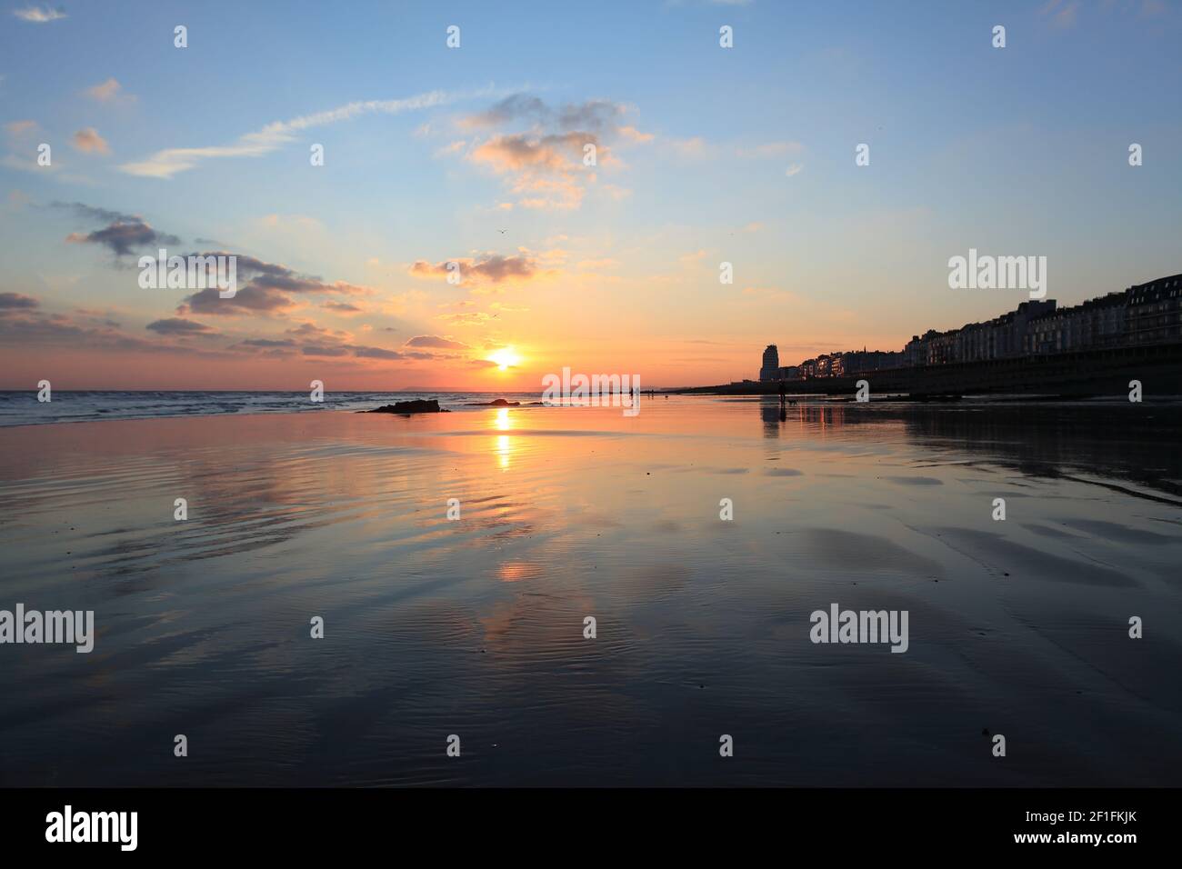 Sun going down over the sea towards St Leonards on sea, Hastings, East Sussex, UK Stock Photo ...