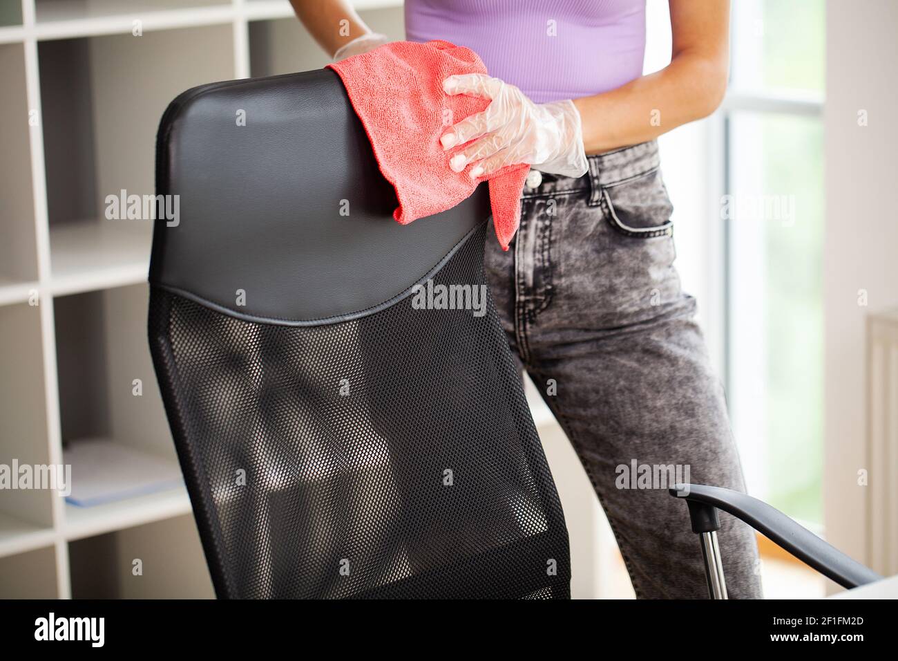Employee of a cleaning company cleans the office Stock Photo - Alamy