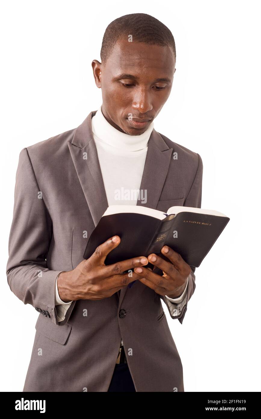 portrait of young pastor standing and reading a Bible in his hand Stock ...