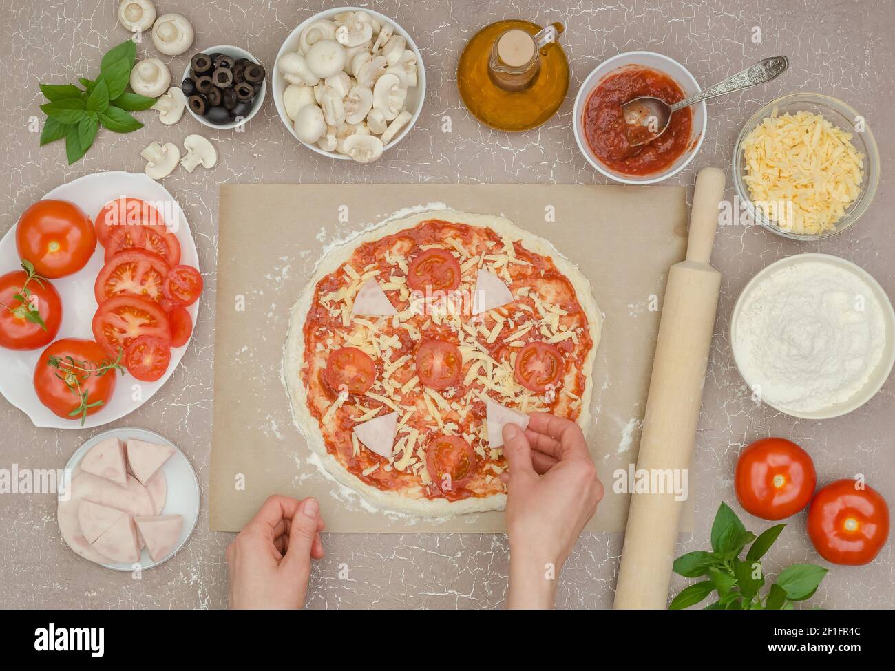 Step-by-step cooking of homemade pizza with ham, step 7- put ham slices ...
