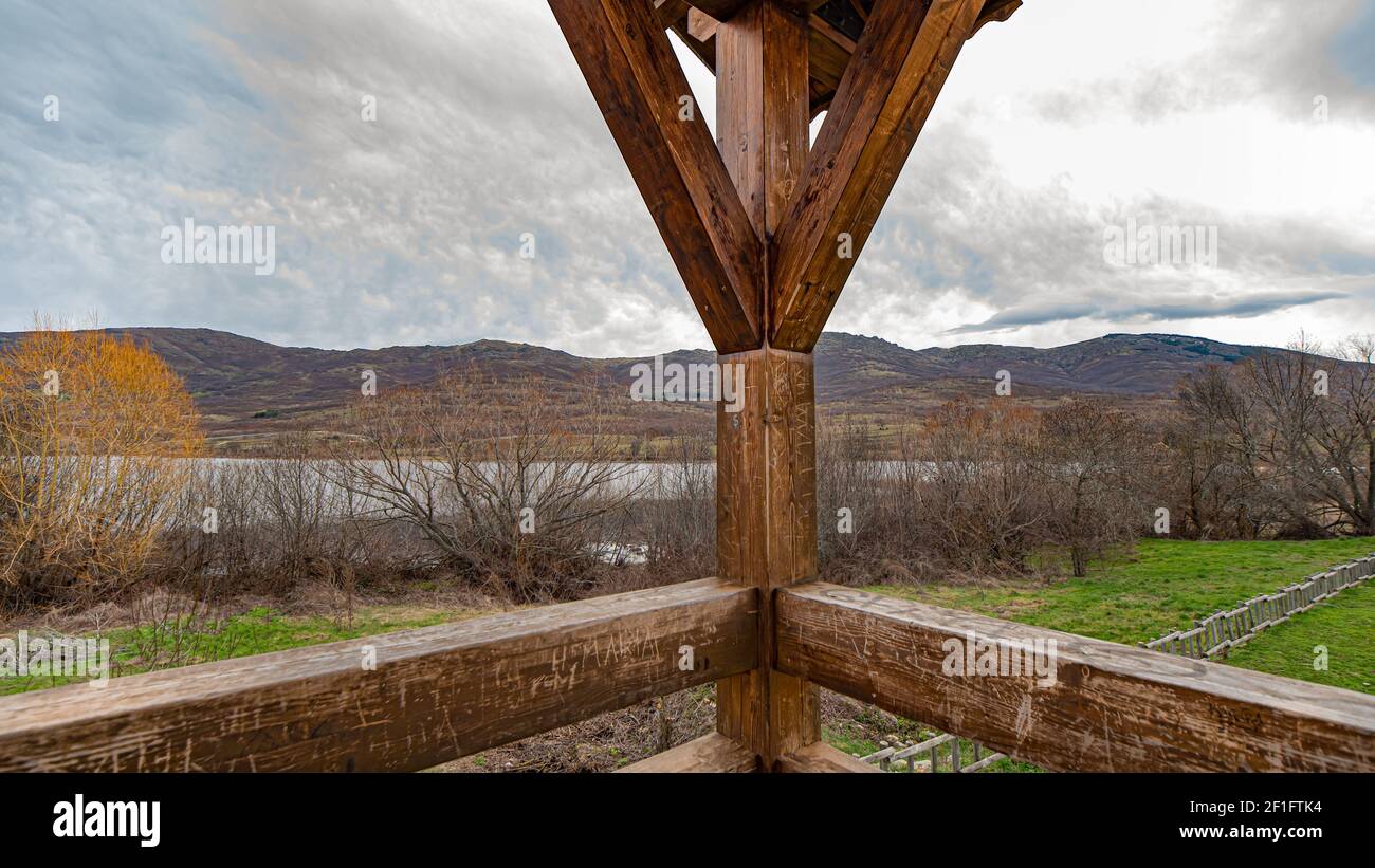 Observing the mountain scenery on a cloudy winter day from a lookout ...