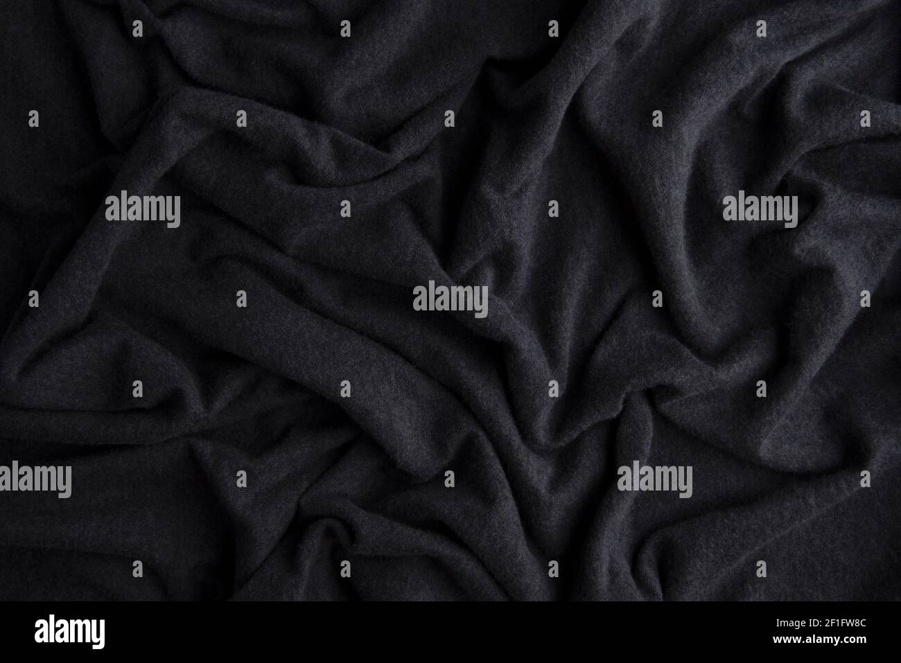 A top view of wrinkled and grooved black cloth texture Stock Photo - Alamy