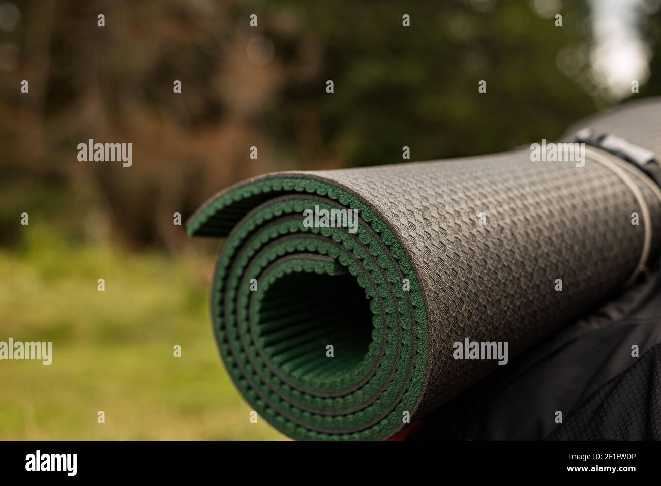 A closeup shot of a rolled rug on a man's back Stock Photo - Alamy
