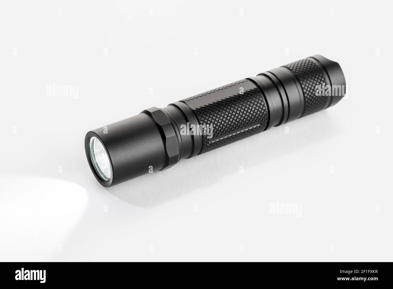 Modern aluminum Pocket Flashlight switch on isolated on white ...