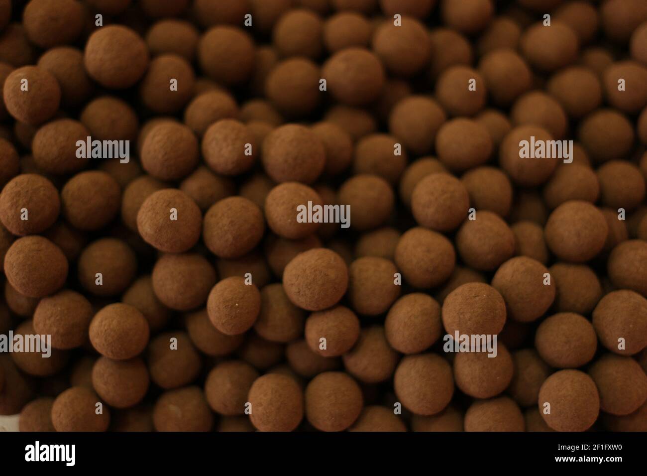 Cocoa dusted chocolate balls texture Stock Photo - Alamy