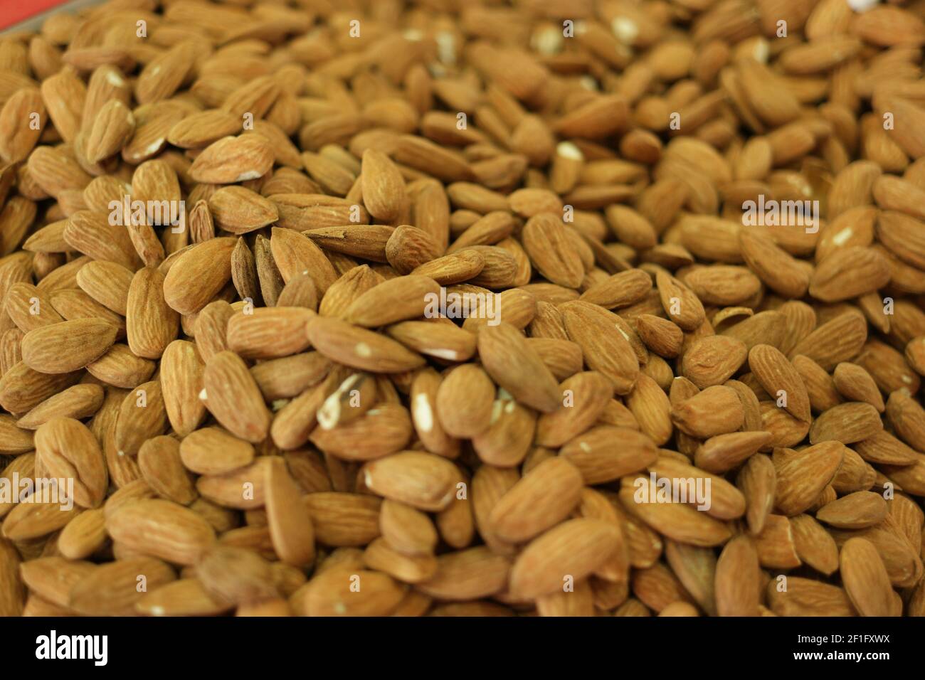 Pile of almonds close up Stock Photo - Alamy