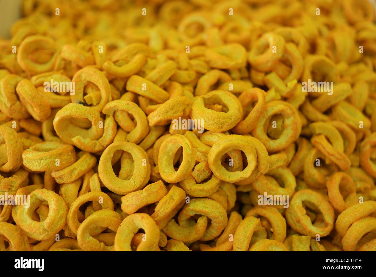 Crispy corn rings background Stock Photo - Alamy