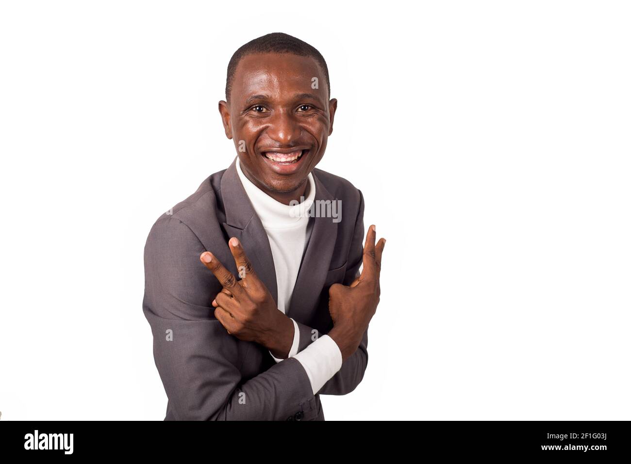 young happy man in suit making victory sign of fingers Stock Photo - Alamy