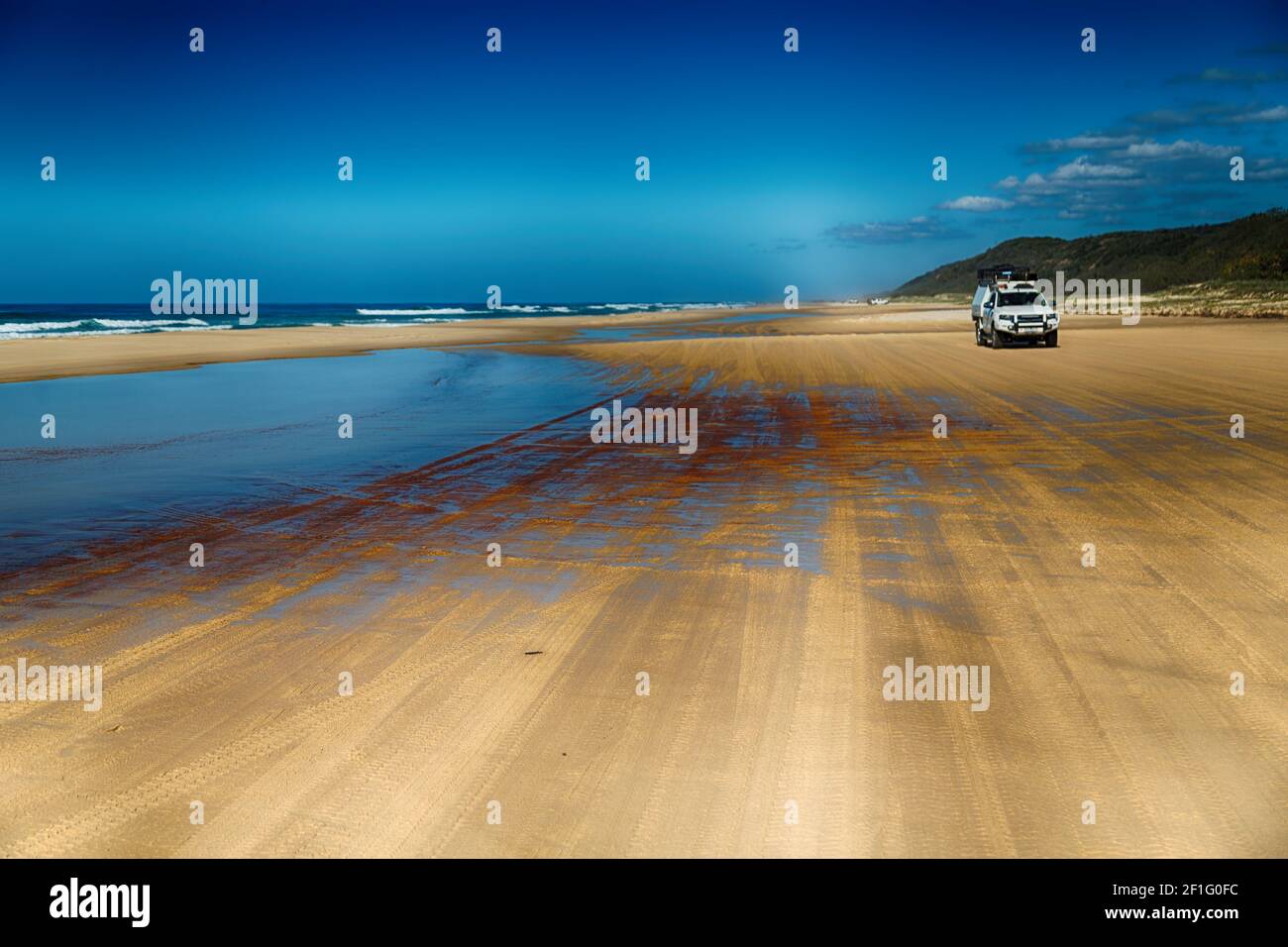 Near the ocean the sand track of the cars Stock Photo - Alamy