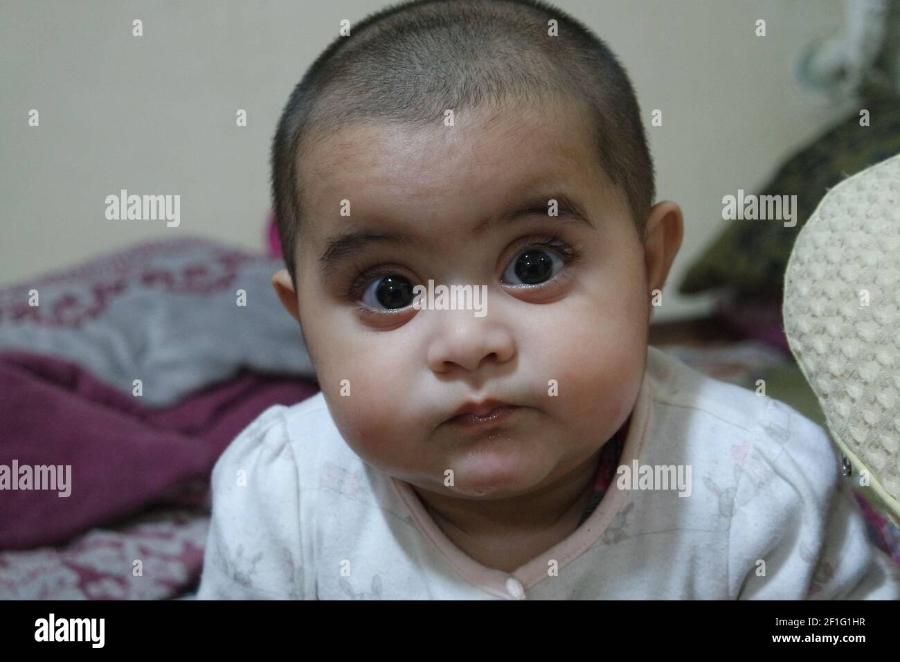 Infant girl making face hi-res stock photography and images - Alamy