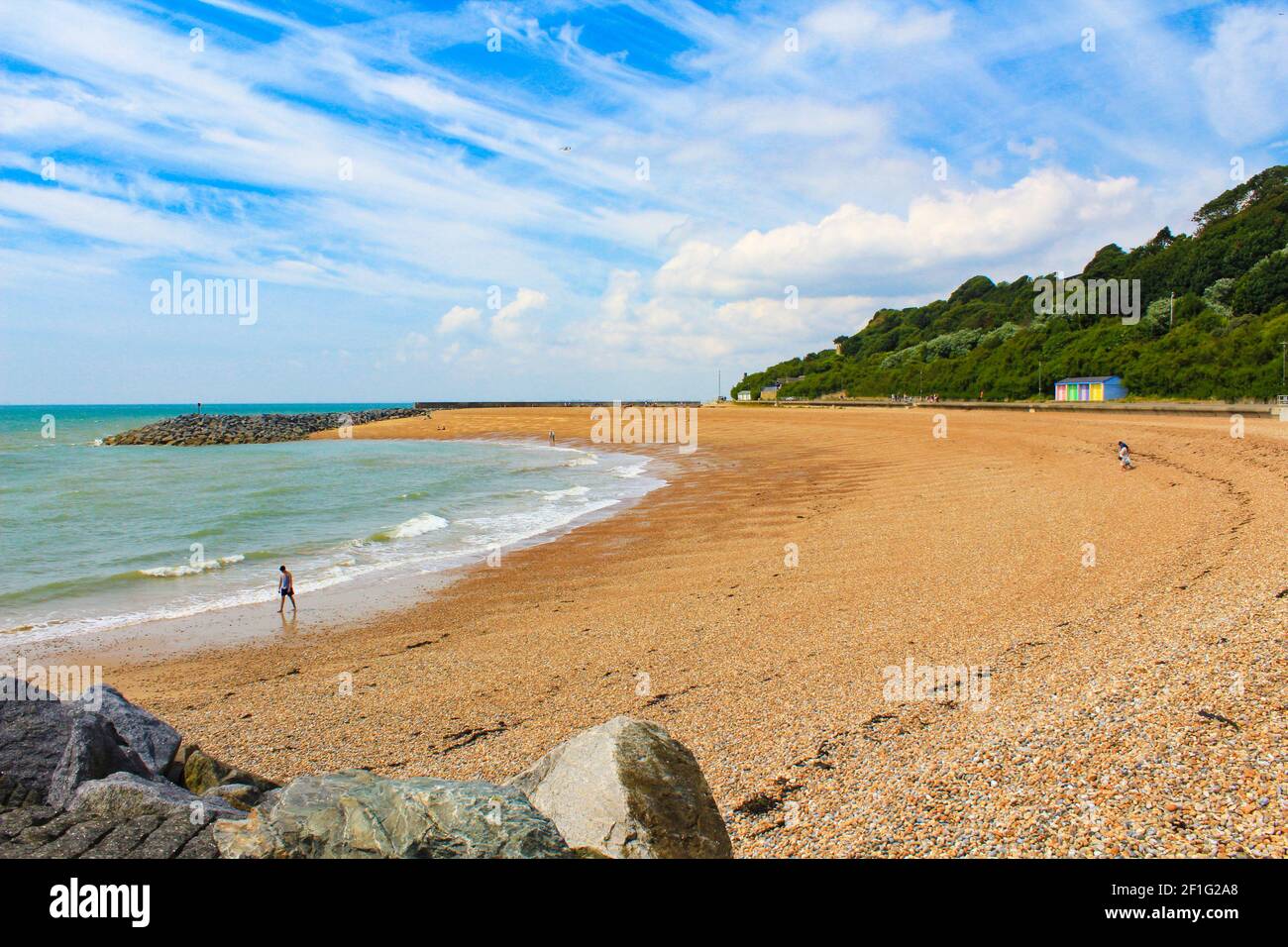 Folkestone promenade and pebble beach on nice summer day against nice ...