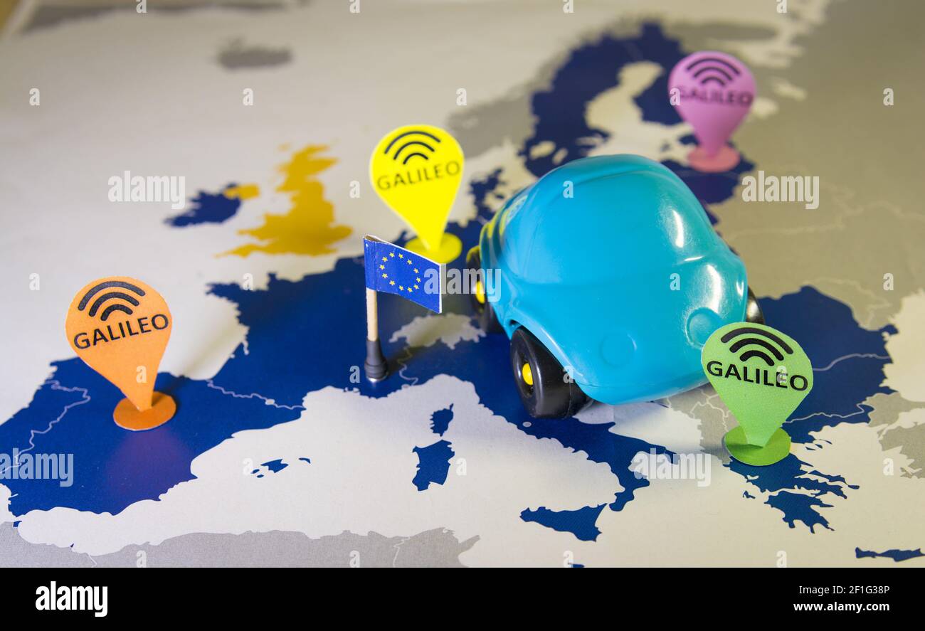 Toy car, Galileo pin and a smartphone Over a EU map. Galileo system ...