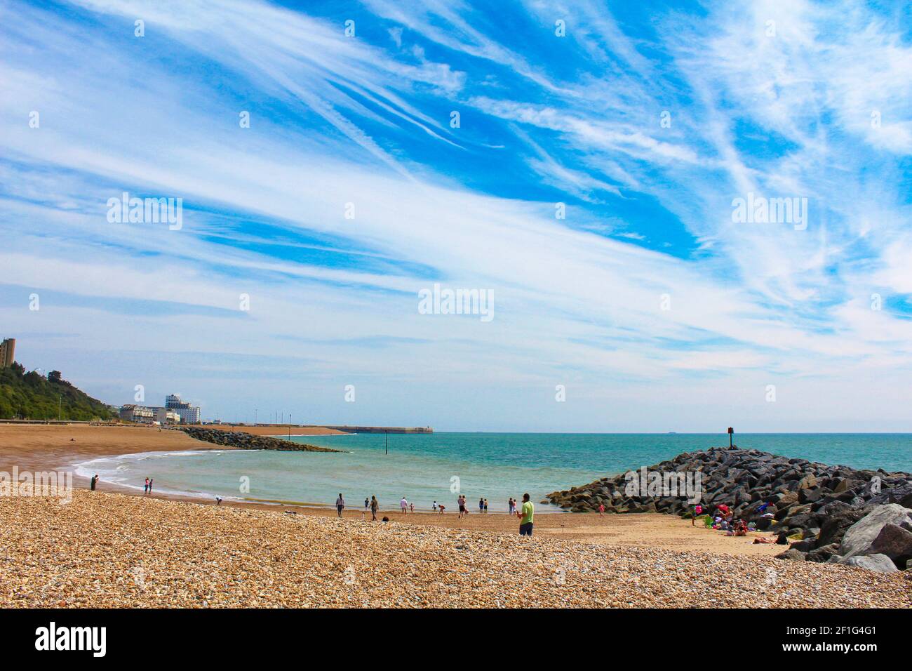 Folkestone promenade and pebble beach on nice summer day against nice ...