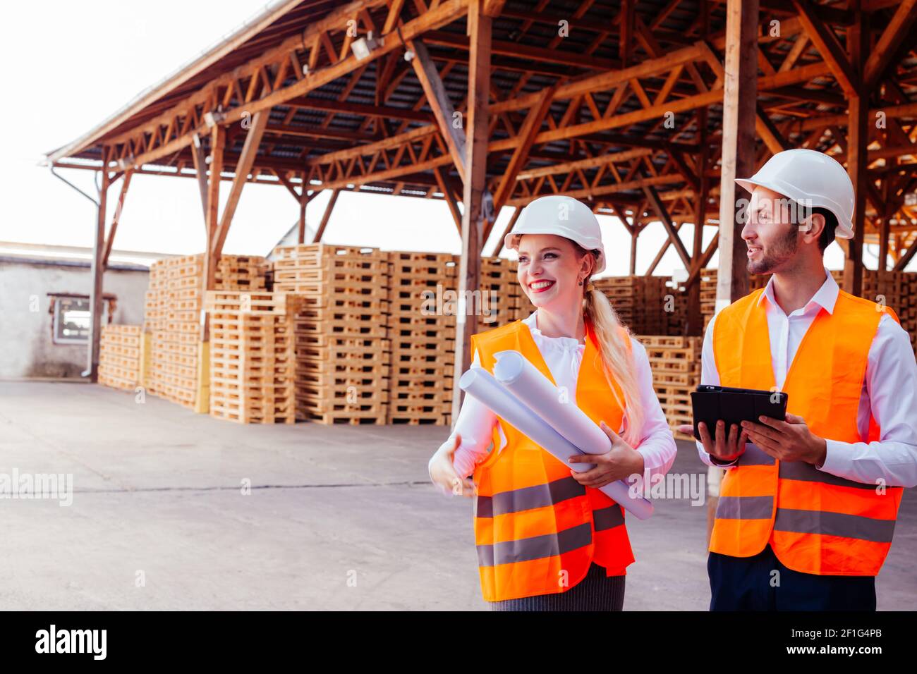Young engineer woman and her subordinate worker at the factory Stock ...