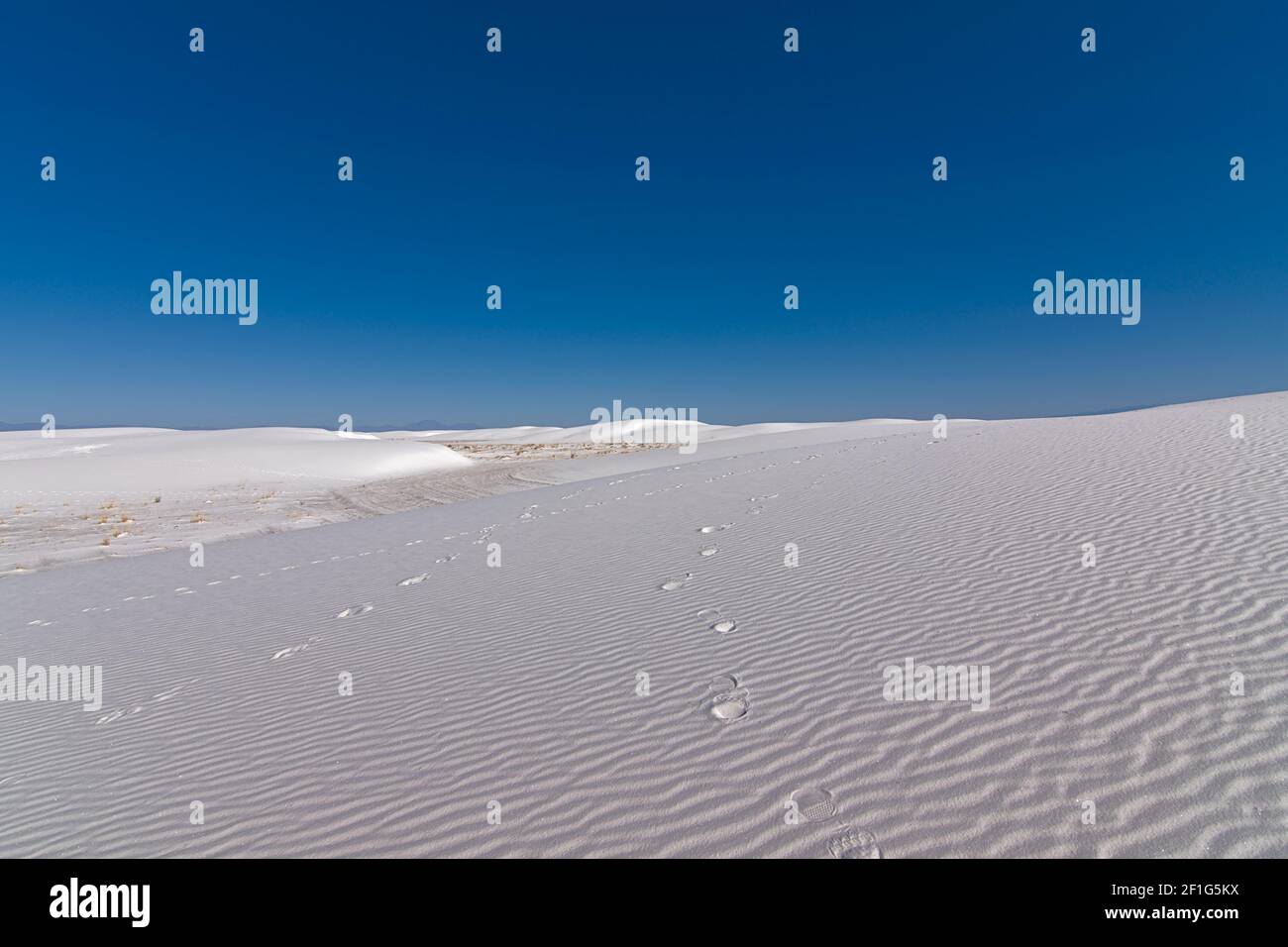 White sand dunes showing wind ripples in formations of gypsum hills at ...