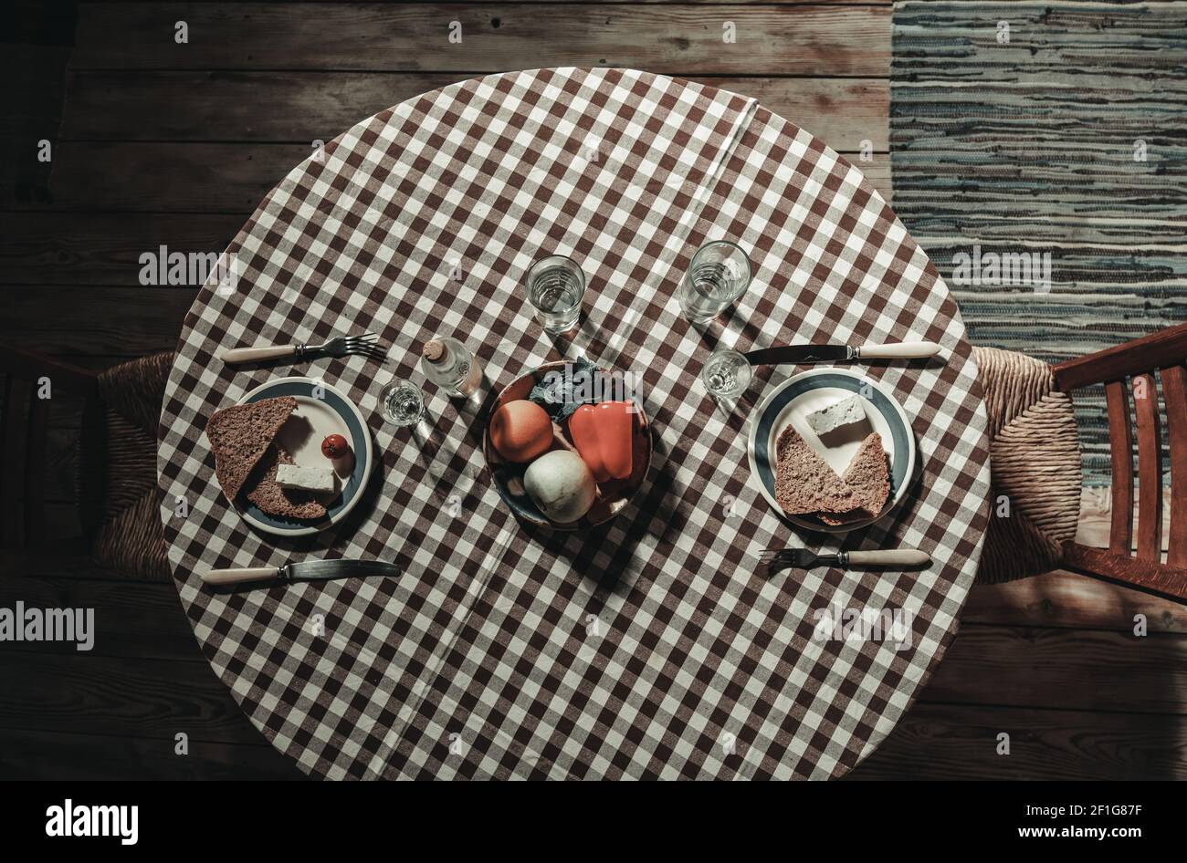Top view from above of rustic food breakfast on round checkered table ...