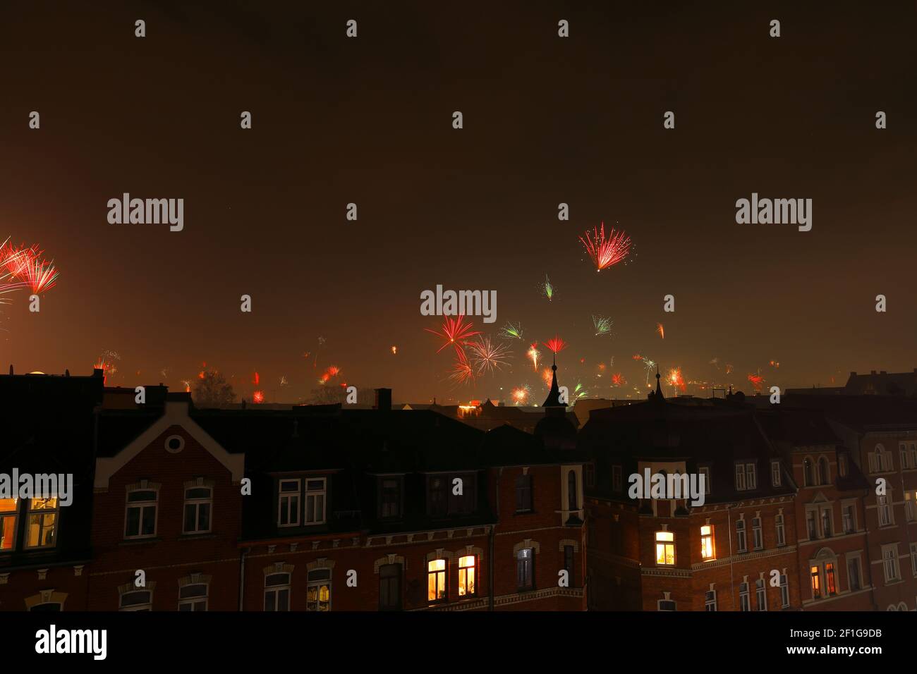 Fireworks over Houses Stock Photo - Alamy