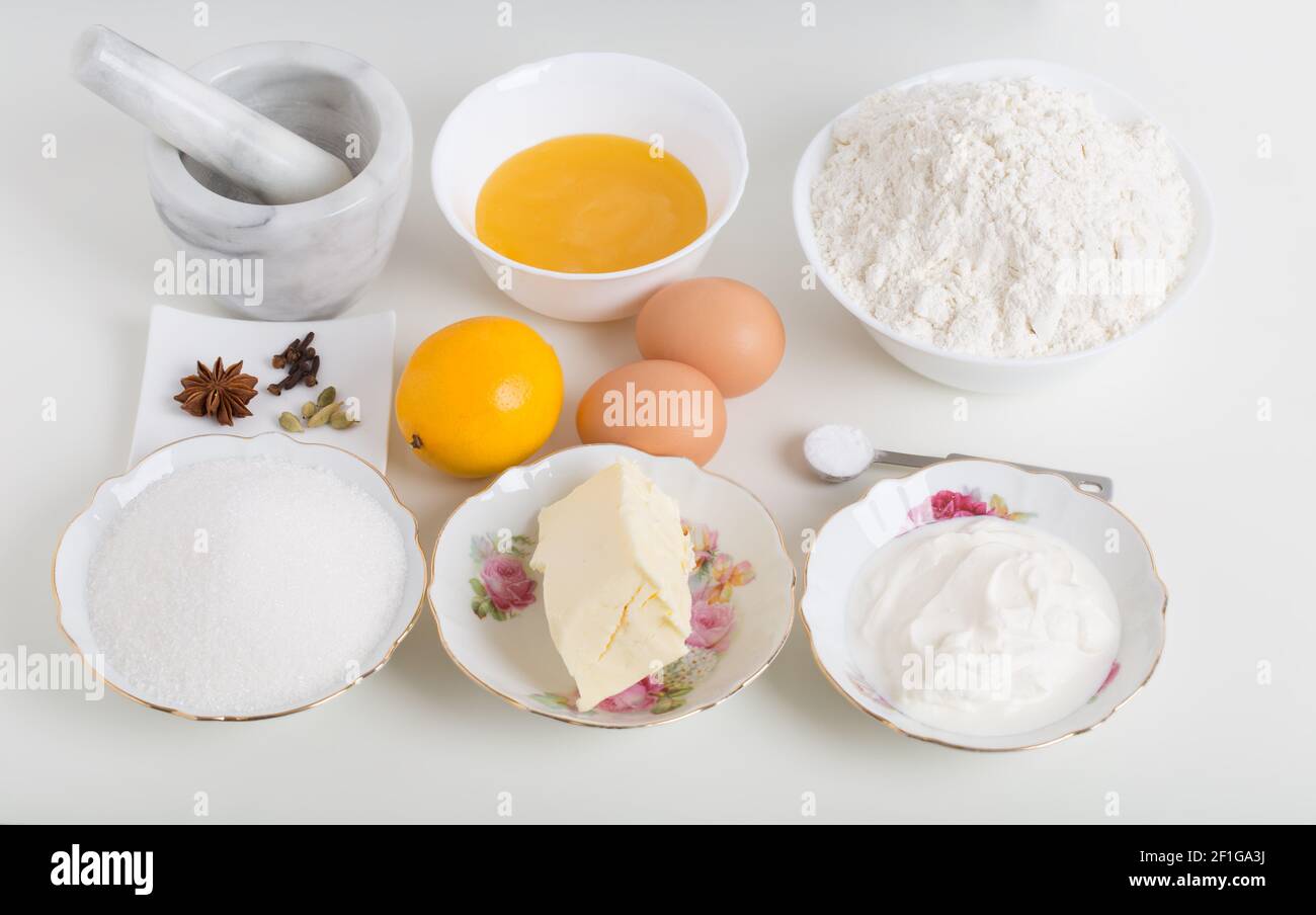 Various ingredients for baking cake. Located on a white background ...