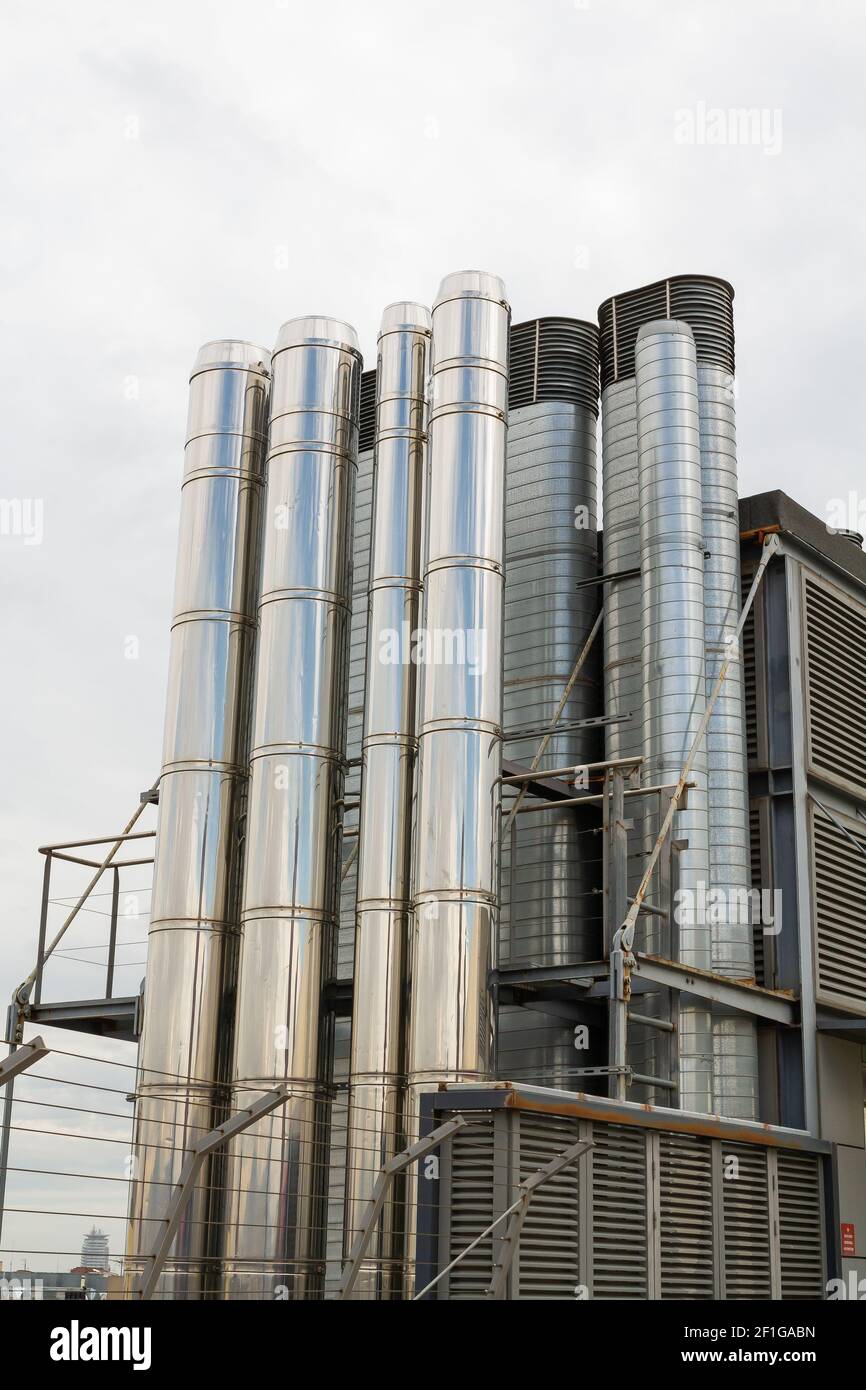 A vertical shot of an industrial building with tubes and vents Stock ...
