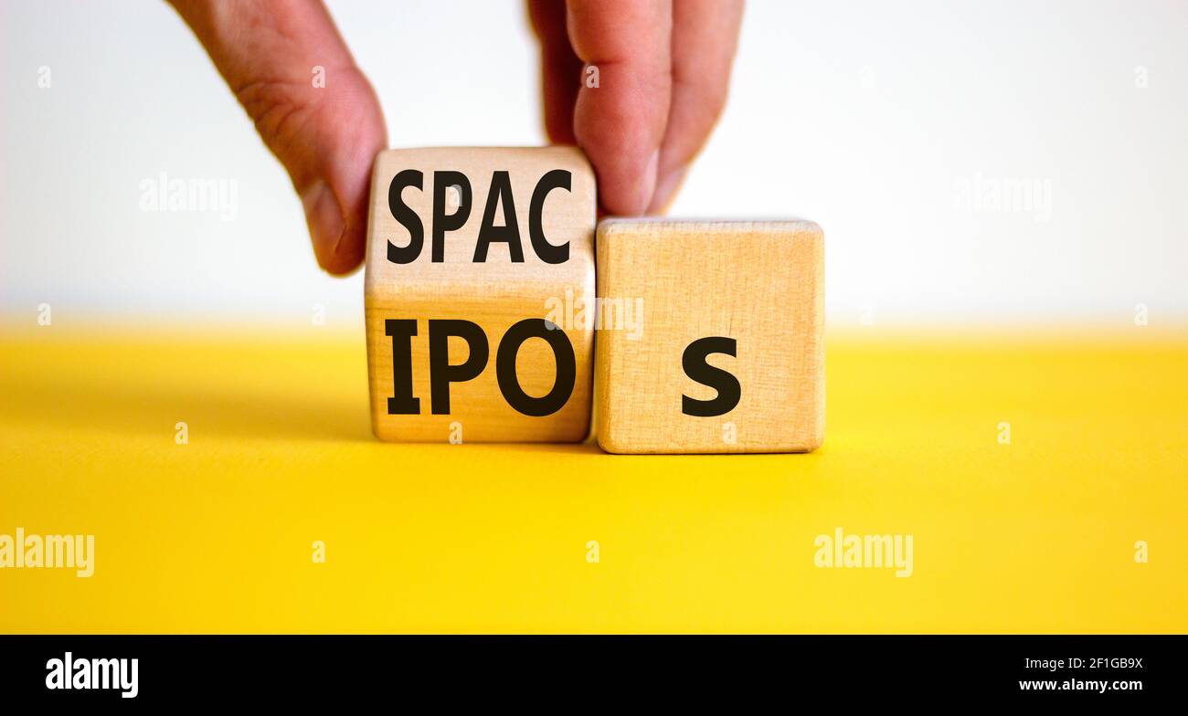 SPAC vs IPO symbol. Wooden cubes with words 'SPAC, special purpose ...