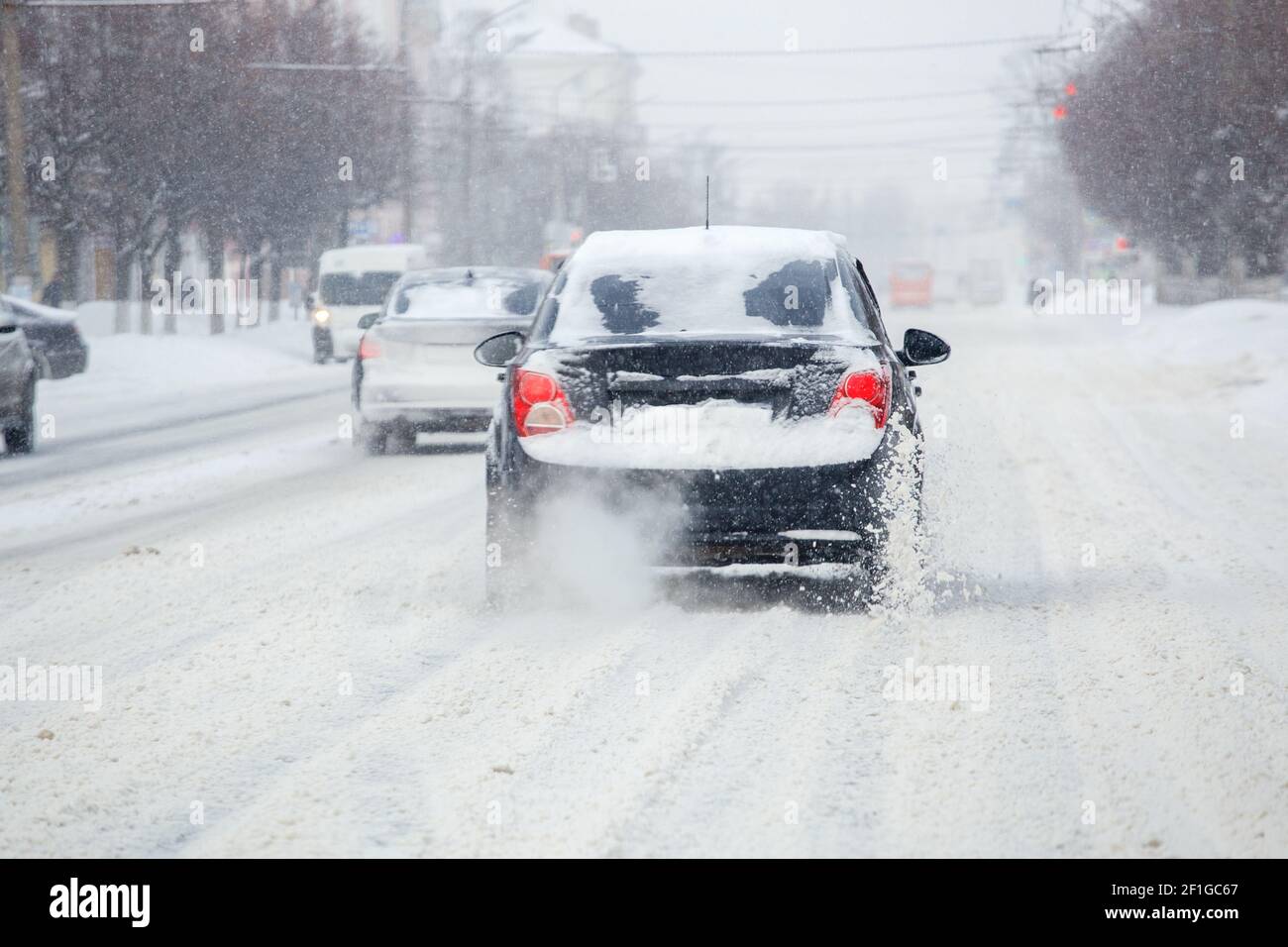 Driving car in blizzard daylight hi-res stock photography and images ...