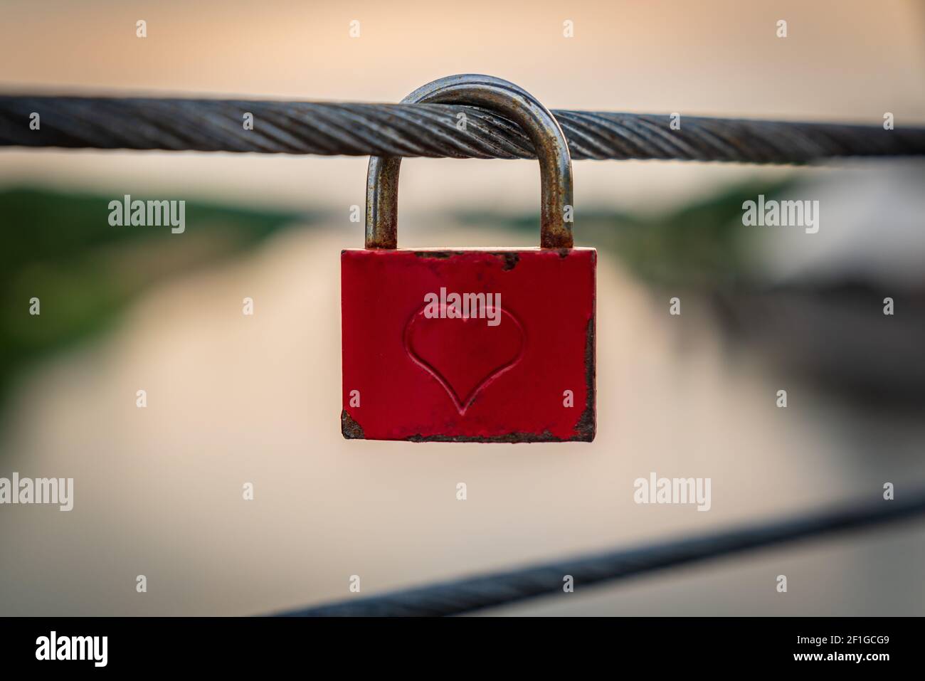 A Love lock on a gate with blurry background Stock Photo - Alamy