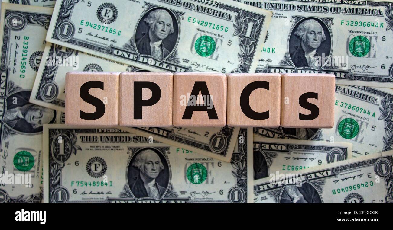 SPACs symbol. Wooden cubes with words 'SPACs, special purpose ...