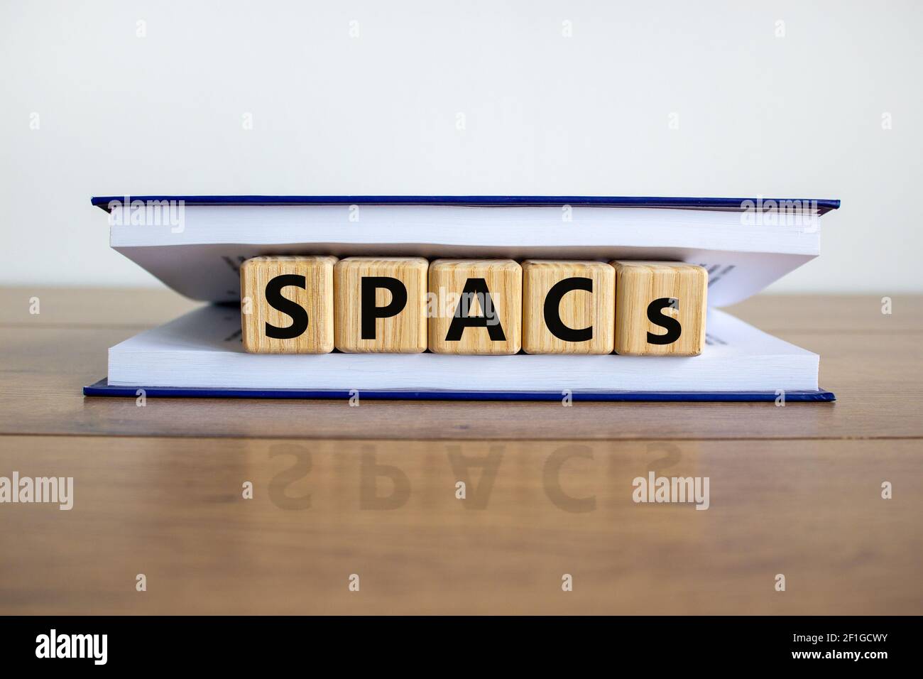 SPACs symbol. Wooden cubes with words 'SPACs, special purpose ...