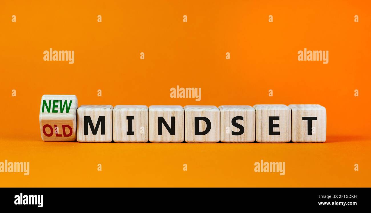New vs old mindset symbol. Turned the wooden cube and changed words ...