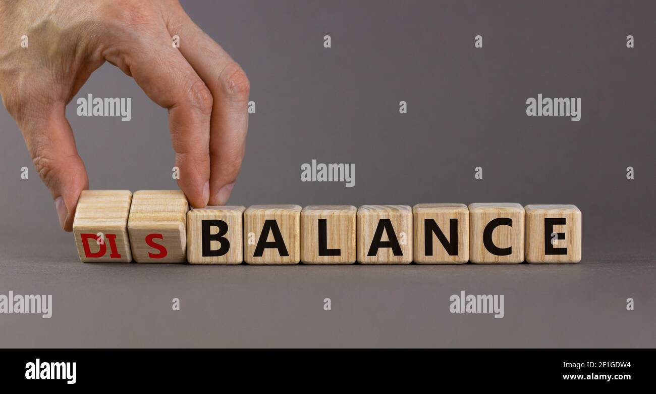 Balance or disbalance symbol. Businessman turns cubes and changes the ...