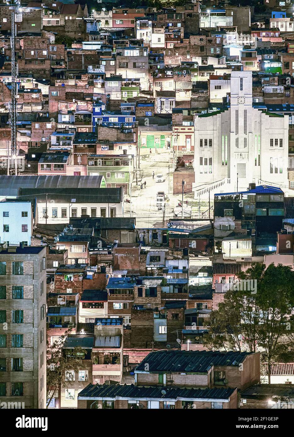 An aerial view of a Bogota cityscape with tiny flats during a nighttime ...