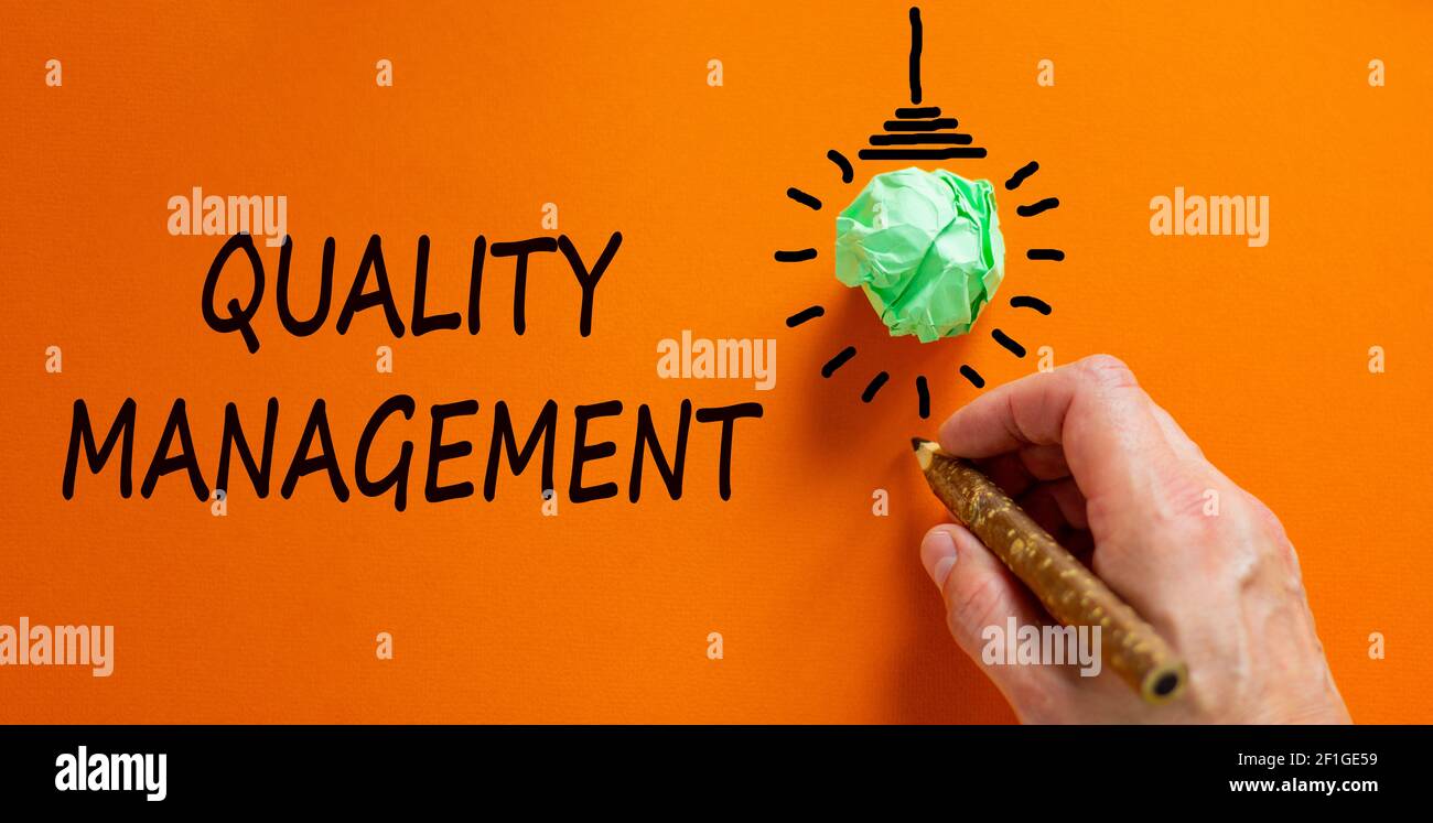 Quality management symbol. Businessman writing words 'Quality ...