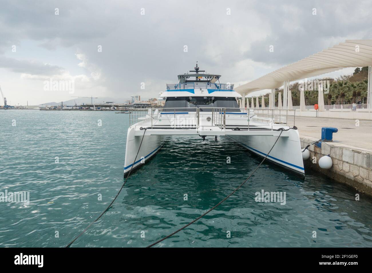 Catamaran for tourist trips moored in Port of Malaga, Muelle uno ...