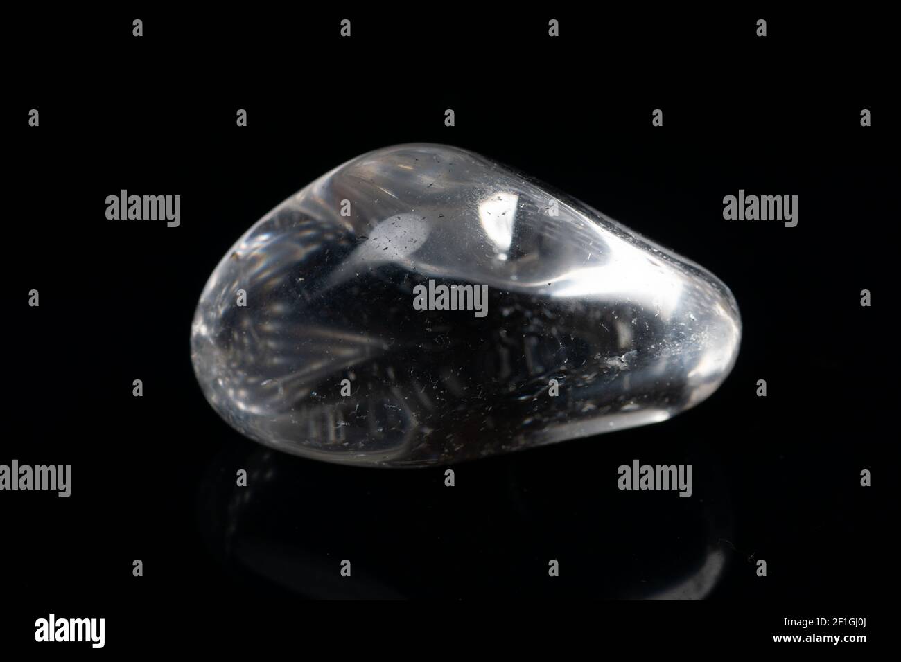Natural mineral quartz on a black background Stock Photo - Alamy