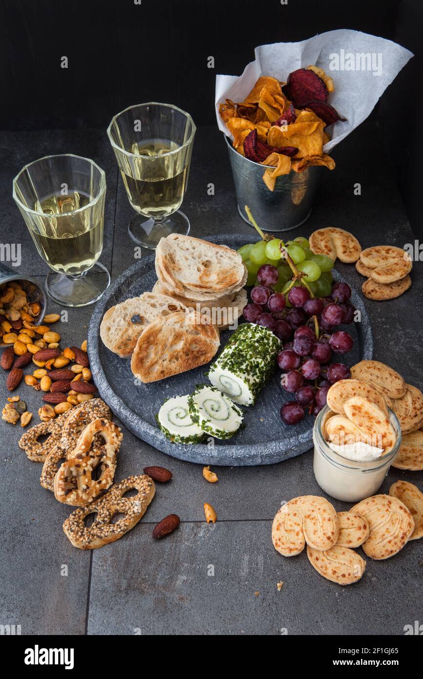 Assorted nibbles and wine Stock Photo - Alamy
