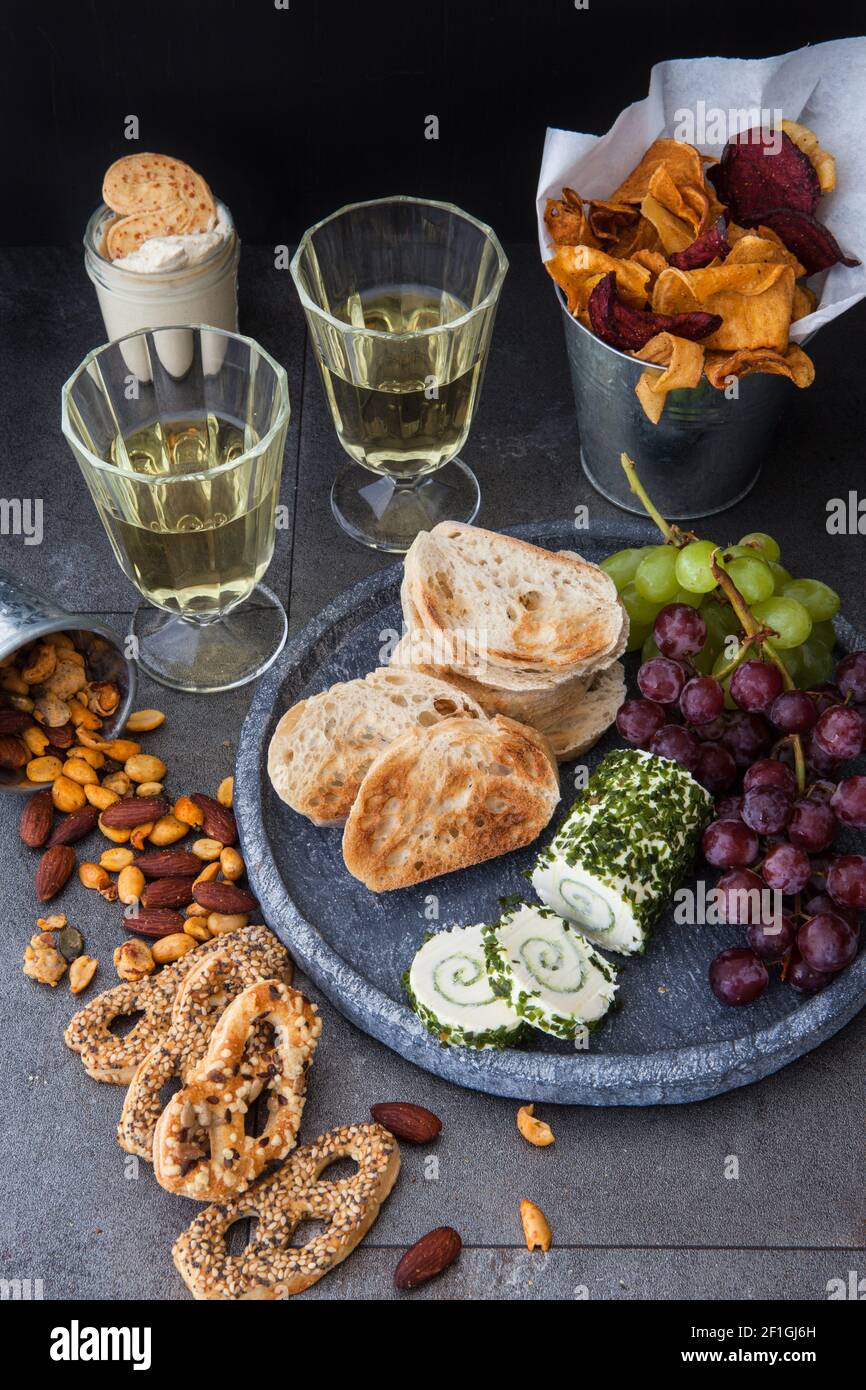 Assorted nibbles and wine Stock Photo - Alamy