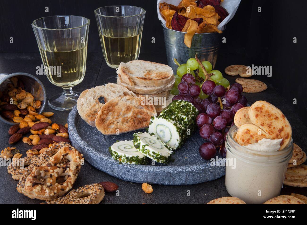 Assorted nibbles and wine Stock Photo - Alamy