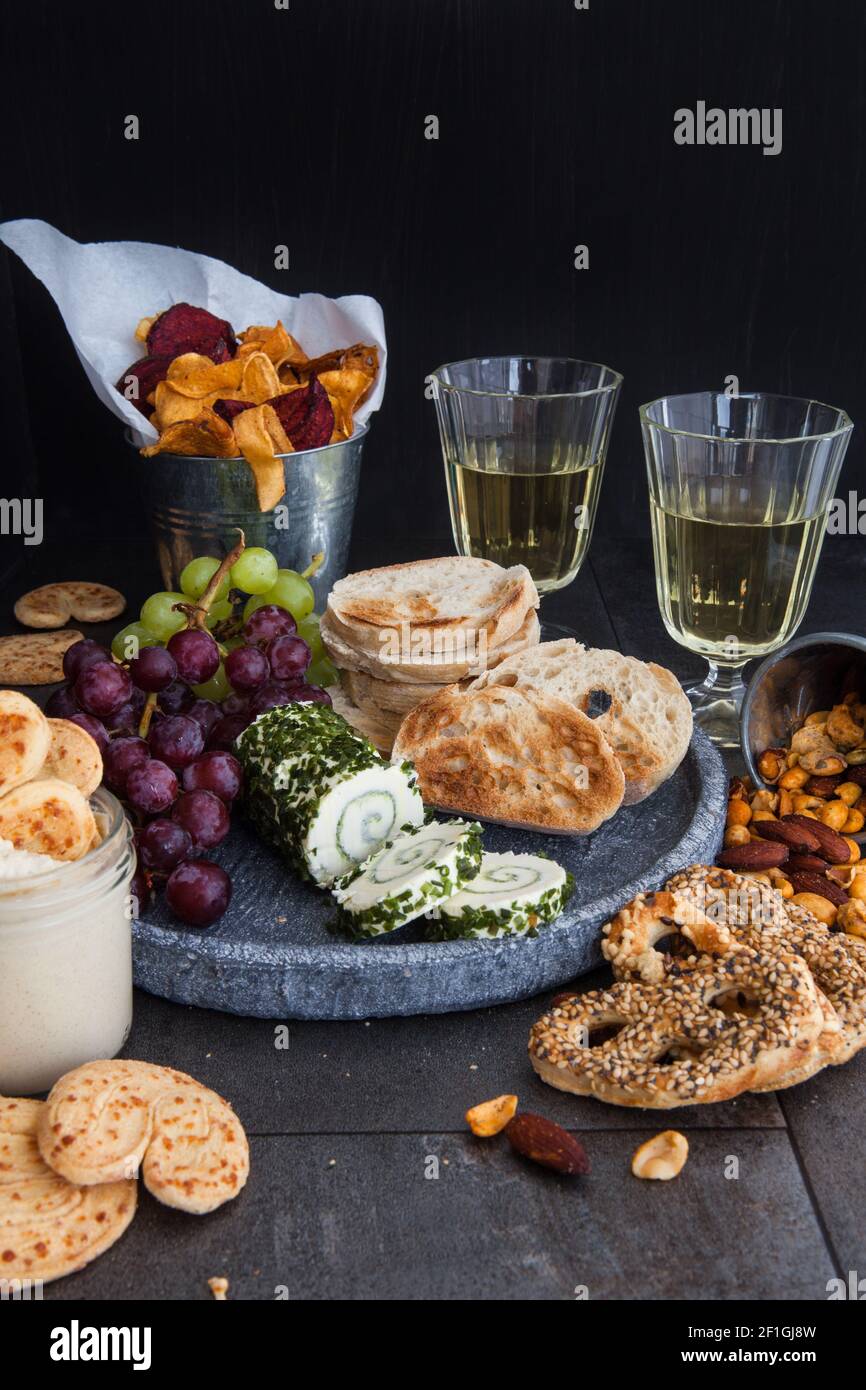 Assorted nibbles and wine Stock Photo - Alamy