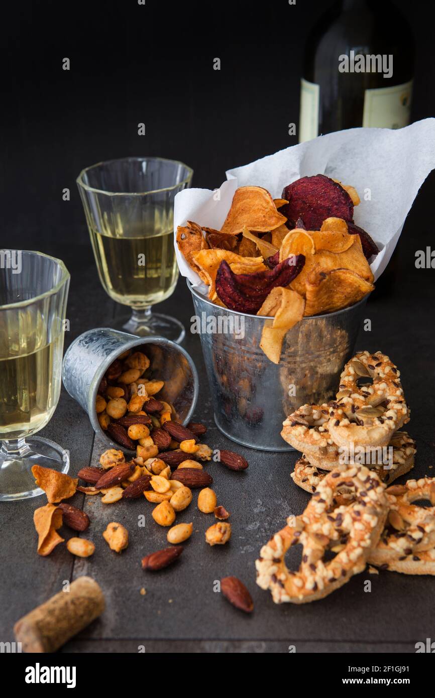 Assorted nibbles and wine Stock Photo - Alamy