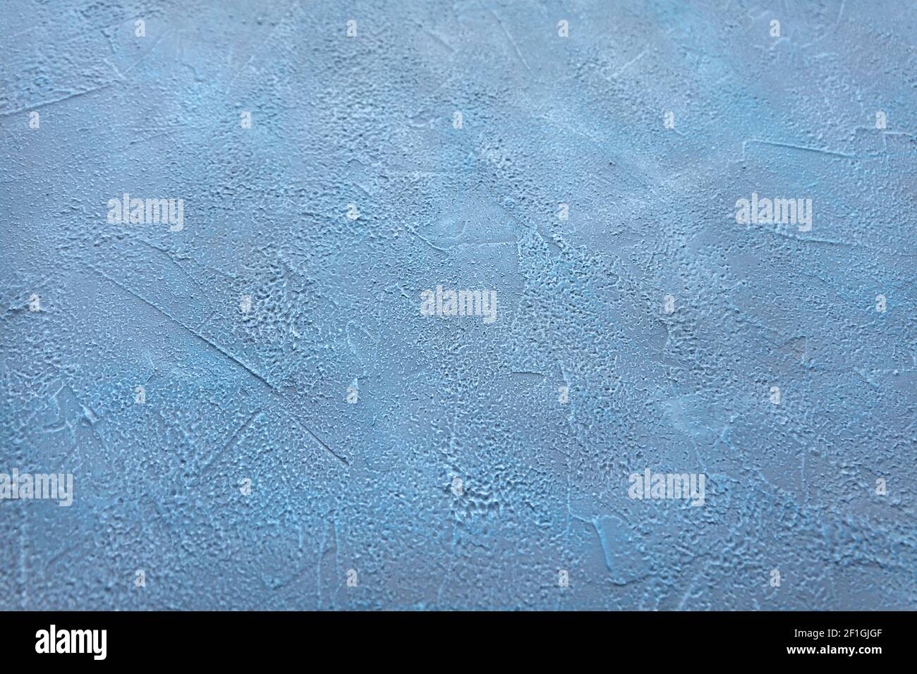 A ready-made abstract textured blue gray background with blurred edges ...