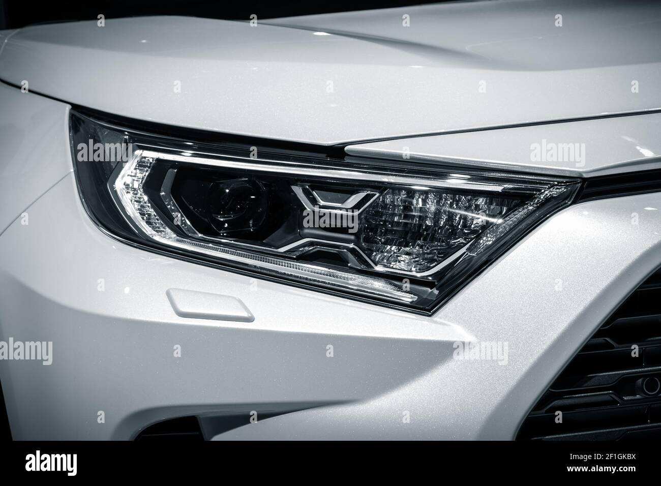 Modern car headlight Stock Photo - Alamy