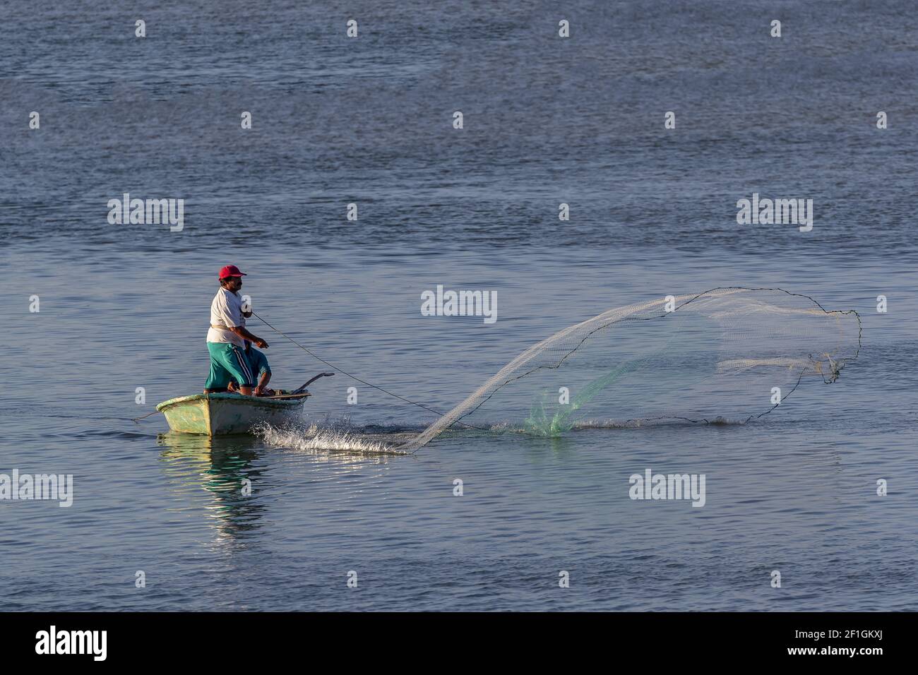 Men casting fishing nets hi-res stock photography and images - Alamy