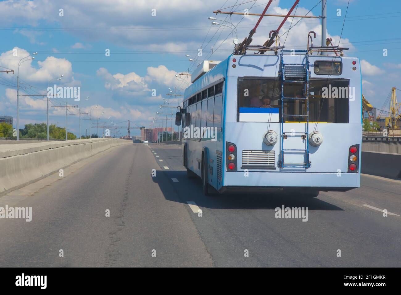 trolley moves along city street Stock Photo - Alamy