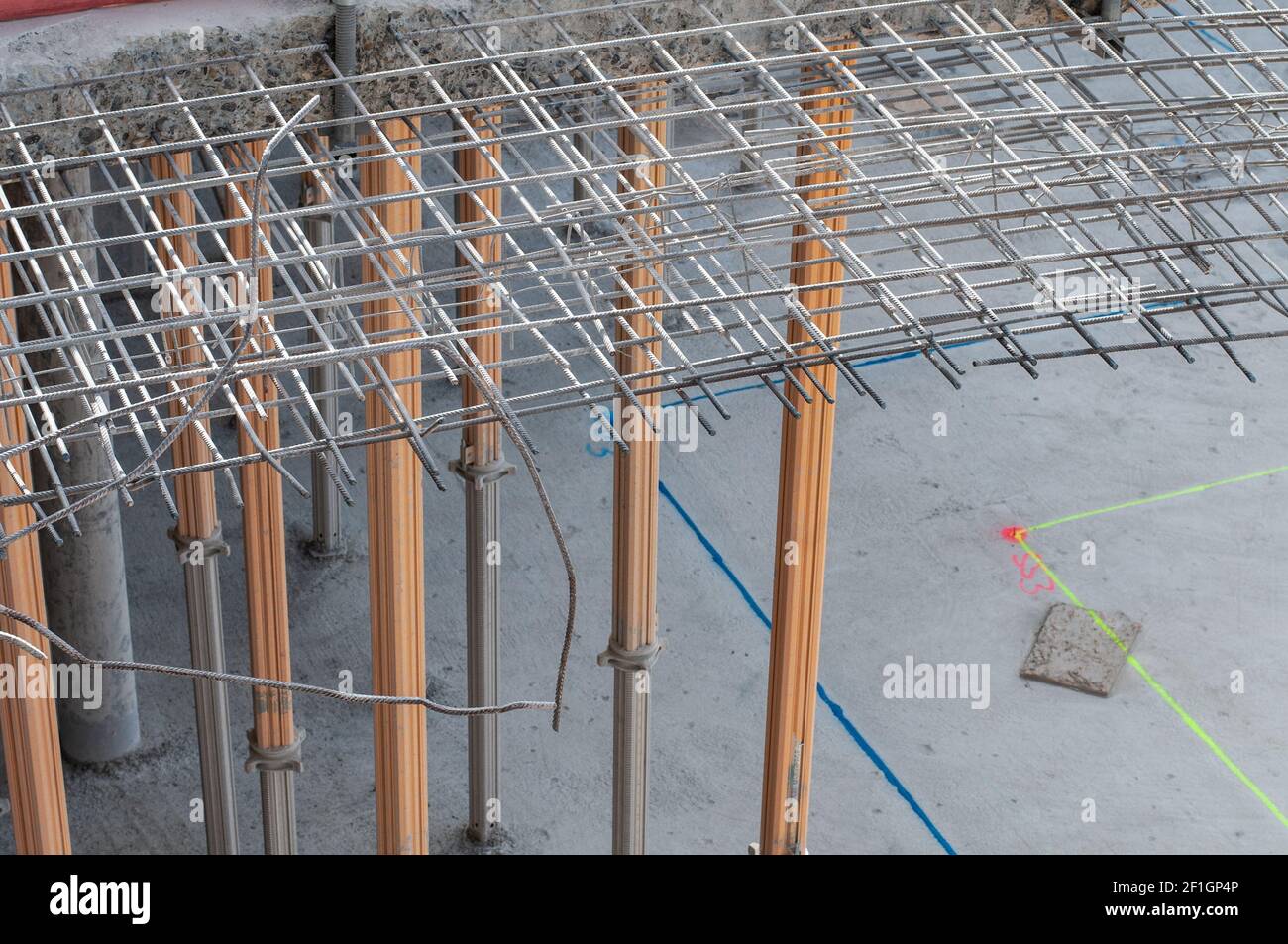 steel post supporting a concrete ceiling at a construction site after ...