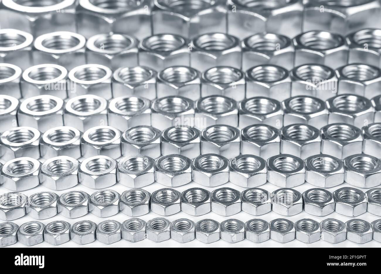 metal shine nuts on white background Stock Photo - Alamy