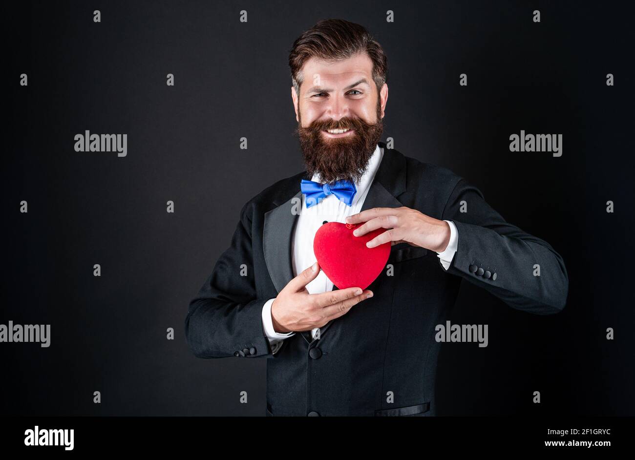 In love. happy handsome man making proposal. romantic gift. tuxedo man ...