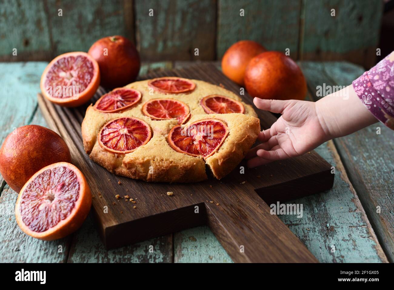 Hand reaching cake hi-res stock photography and images - Alamy